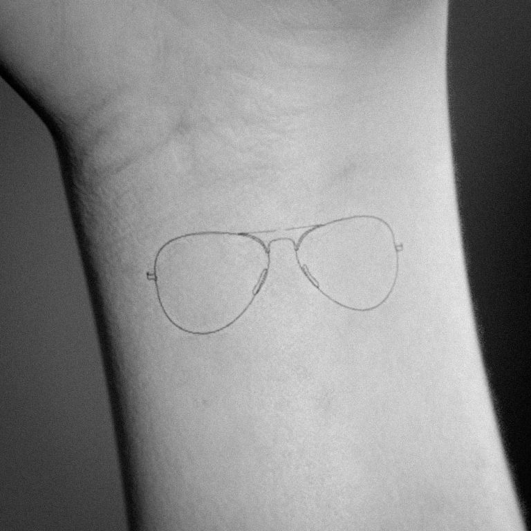 A Simple Black Silhouette Eyeglasses Tattoo Perfect for Minimalists